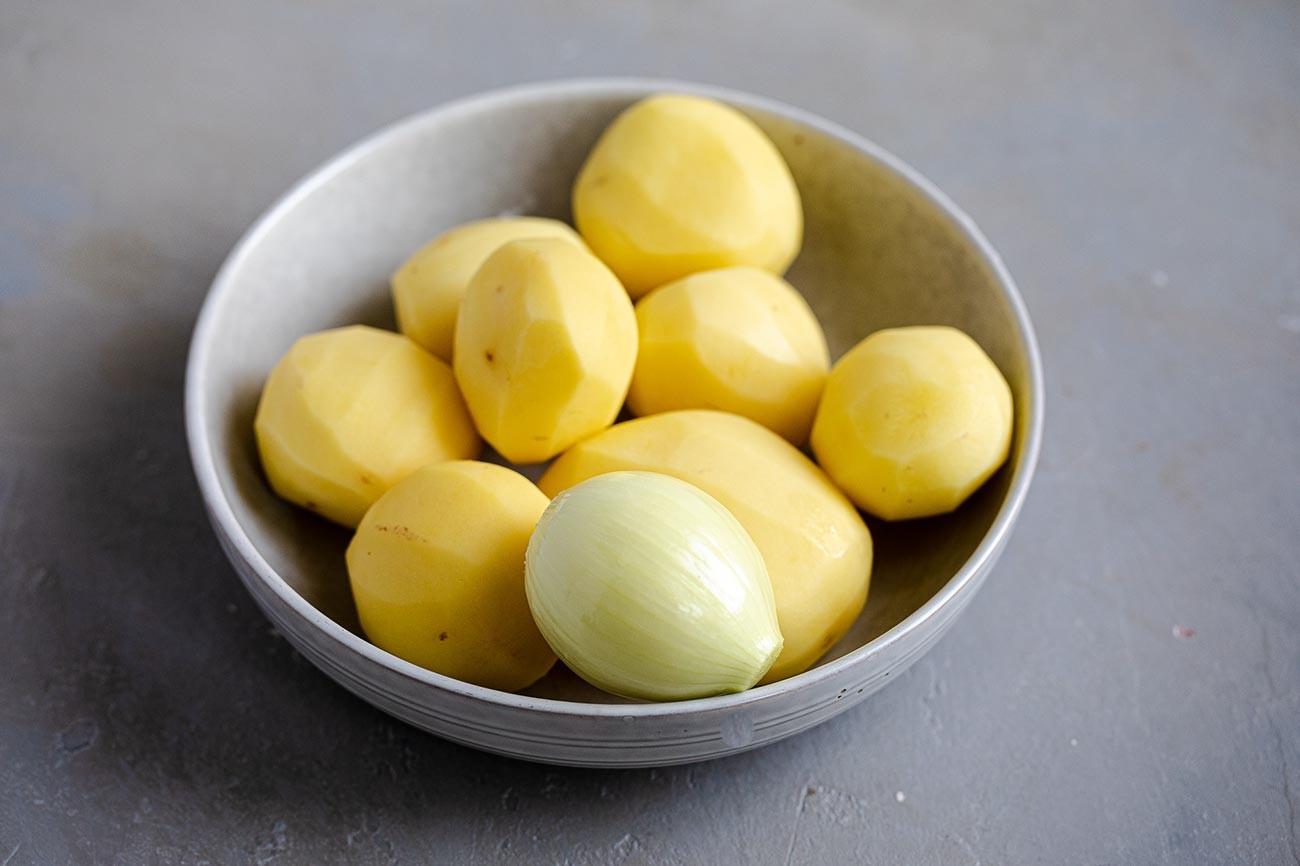 Russian creamy potato cakes served with chanterelles and pickles - you ...