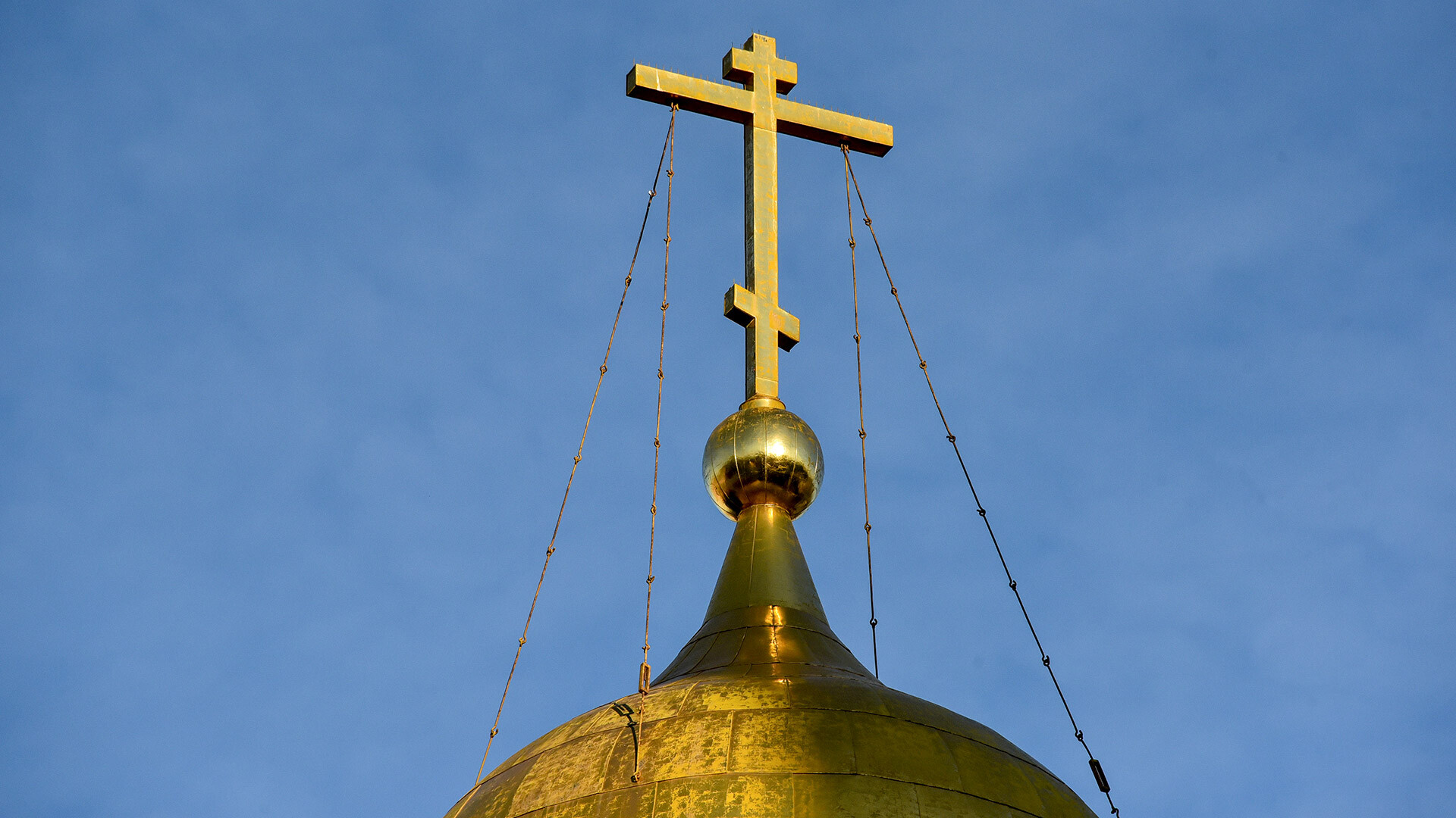 Just curious about the “wires” hanging from the arms of Russian crosses ...